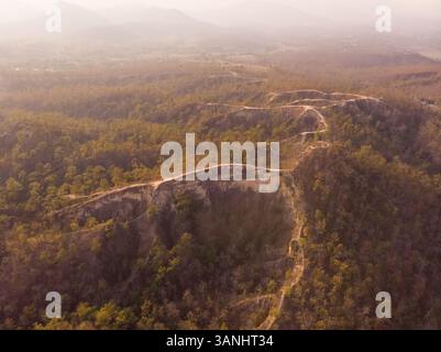 Aerial view of Pai Canyon mountain ridges with a small road driving ...