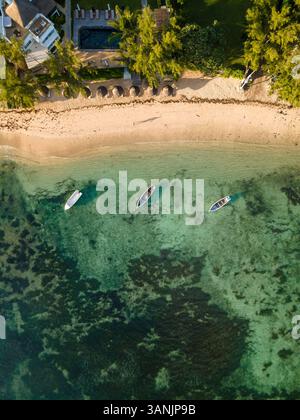 Aerial view of Pointe aux Canonniers coastline and clear Indian Ocean ...