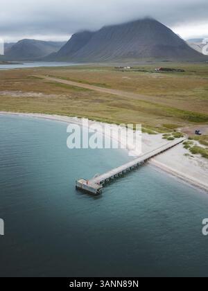 Aerial view of serene Onundarfjordur Pier surrounded by majestic ...