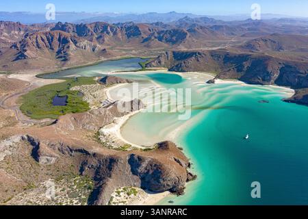 Aerial view of beautiful Balandra beach with clear blue water and rocky ...
