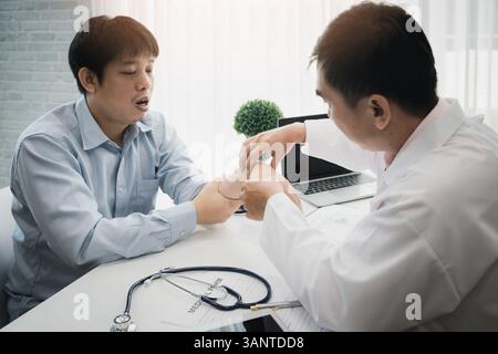 Orthopaedic doctor doing physical examination patient with wrist pain ...