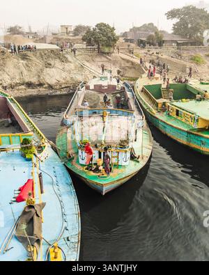 Aerial view of busy boats and cement industries along the river in an ...