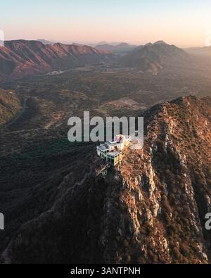 Aerial view of Shree Savitri Mata Temple on a mountain at sunset ...