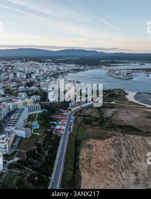 Aerial drone view of Portimao skyline and city beach of Praia da Rocha ...