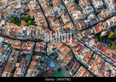 Aerial top down view of Sitges downtown with red rooftops and ...