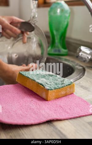Kitchen sponge with foam on light blue background, top view Stock Photo ...