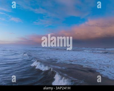 Aerial view of scenic Mocrocks Beach with people clamming for razor ...