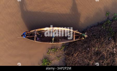 Aerial view of serene ogun river with picturesque village and ...
