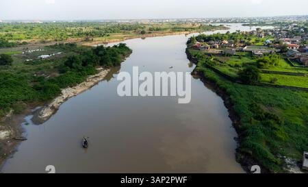 Aerial view of the beautiful Ogun River surrounded by lush greenery and ...