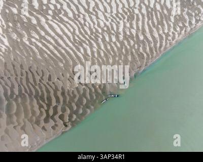 Aerial view of the dry riverbed of the Jamuna River with traditional ...