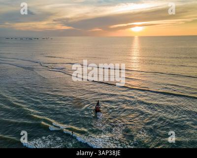 Aerial view of Inani Beach with fishing boats and people enjoying the ...