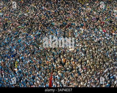Aerial view of vibrant Dahi Handi festival with a bustling crowd ...