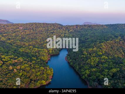 Aerial view of Charlotte lake surrounded by forest, Matheran ...