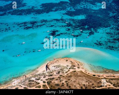 Aerial view of paradise beach and Ningaloo Reef with wind turbines ...