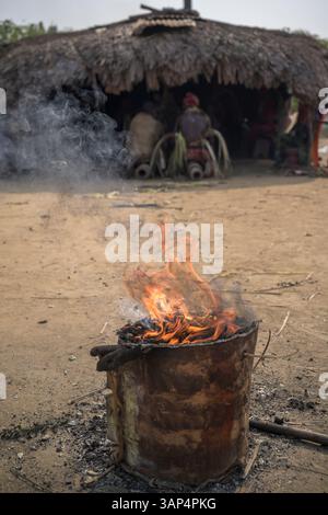 Ritual fire lit in front of the temple where a Bwiti ceremony has been ...