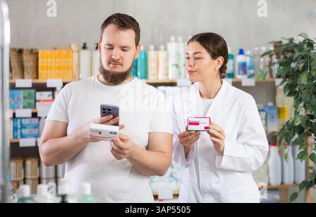 Man buyer scans paracetamol qr code with woman pharmacist Stock Photo ...