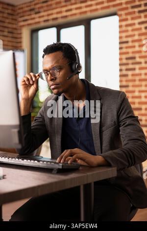 Asian businessman working while attending online meeting with ...