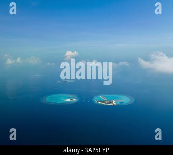 Aerial view of scattered islands with blue ocean water at Wajag Island ...