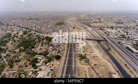Aerial view of lyari expressway with dense urban architecture and ...