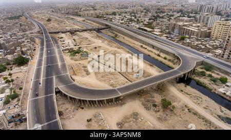 Aerial view of lyari expressway with busy traffic and modern buildings ...