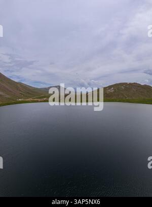 Aerial view of deosai plains with majestic mountains, serene lake, and ...
