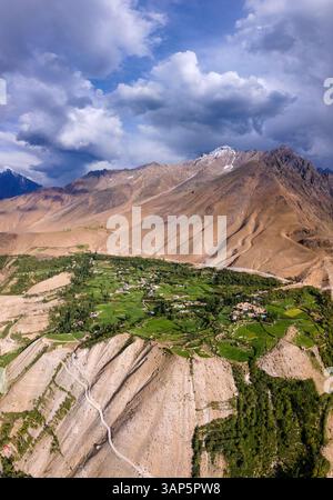 Aerial view of serene Phander Valley with river and majestic Himalayas ...