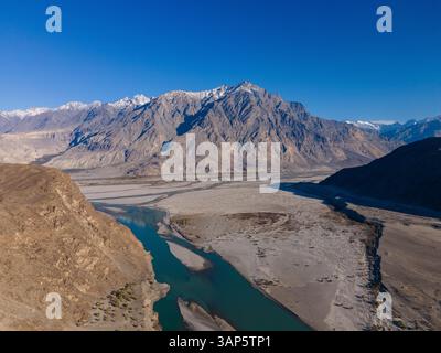 Aerial view of Majestic Indus River and remote valley, Gilgit-Baltistan ...