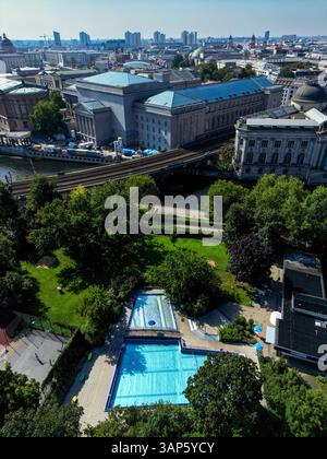 Aerial view of modern public pools with geometric swim lanes and clear ...