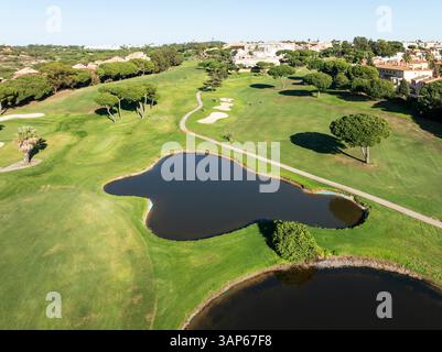 Aerial view of Islantilla Golf Resort with beautiful green golf course ...