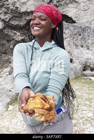 Mauritian woman, 35 years old, laughing, walking through a casuarina ...