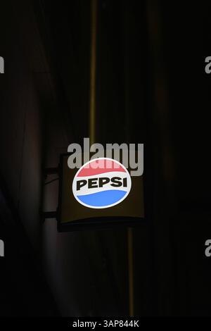 Illuminated sign for the Pepsi-Cola brand of the manufacturer PepsiCo ...