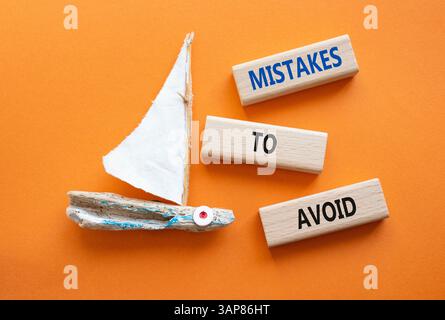 Mistakes to Avoid symbol. Wooden blocks with words Mistakes to Avoid ...