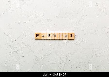 examples word written on wood block. examples text on table, concept ...