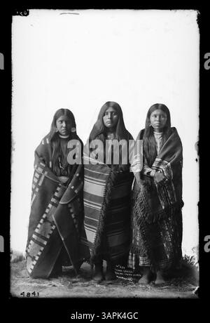 The photograph depicts Yakima Indians dressed in full regalia ...