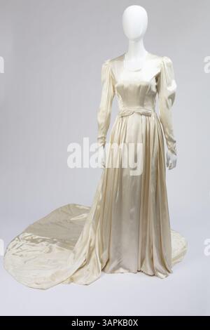 The ivory rayon satin wedding dress and tulle veil worn by Mildred ...