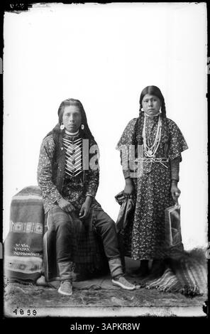This photograph features Yakima Indians dressed in regalia, showcasing ...