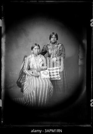 A portrait of Yakima Indians in traditional regalia, taken by Lee ...
