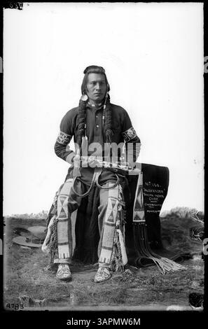 This image depicts Alexander, a Yakima tribal man, dressed in ...