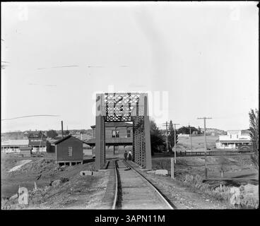The image features a railroad bridge from the Ferrocarril Mexicano ...