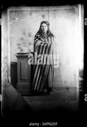 A portrait of Yakima Indians in traditional regalia, photographed by ...