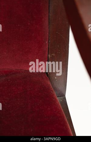 High-backed priest's chair with a red velvet upholstered seat and back ...