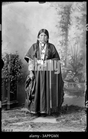 This photograph depicts Yakima Indians dressed in traditional regalia ...