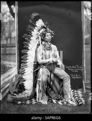 Lack-um-tim, a Warm Springs Indian, is shown in traditional regalia in ...