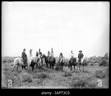 A group of Yakima Indian men, including White Swan, mounted in regalia ...