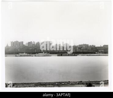 This black and white photograph captures steamboats at the St. Louis ...