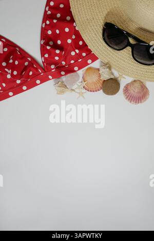 Beach accessories straw hat and seashell on colored table. Summer ...