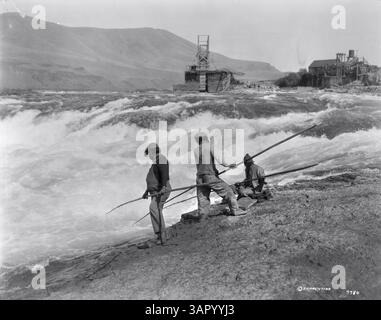 The image *Fishing for Salmon at Celilo Falls* depicts traditional ...