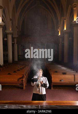 Catholic mass. Altar Boy with incense boat. France Stock Photo - Alamy