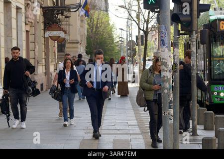 Romanian presidential candidate Nicusor Dan, center, gestures next to ...