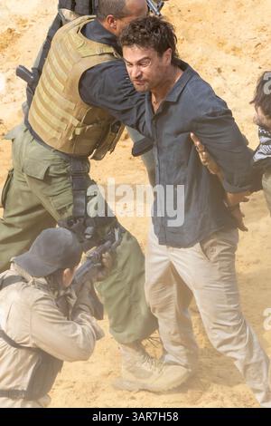 Arron Taylor and Theo James filming Fuze in a Quarry in Kent Stock ...